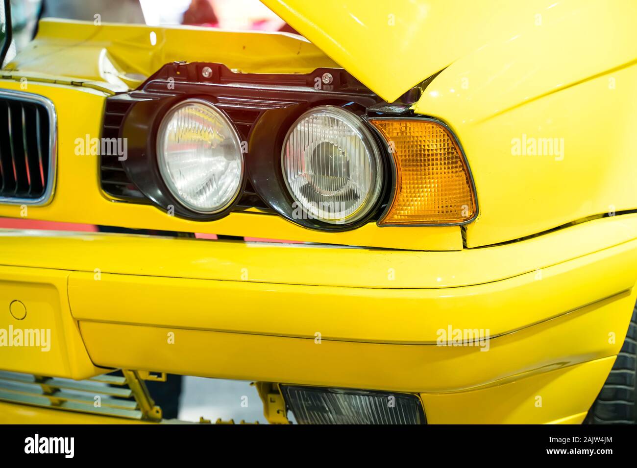 red Automotive Front End headlight of the car close up Stock Photo - Alamy