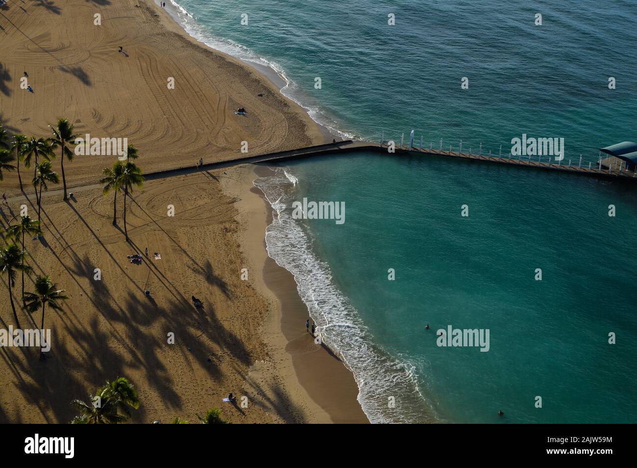 Hawaii beach from above, showing sand, sea, waves and palm trees Stock ...
