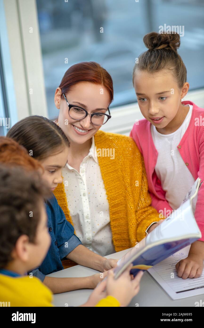 Children learning English grammar with their teacher Stock Photo - Alamy