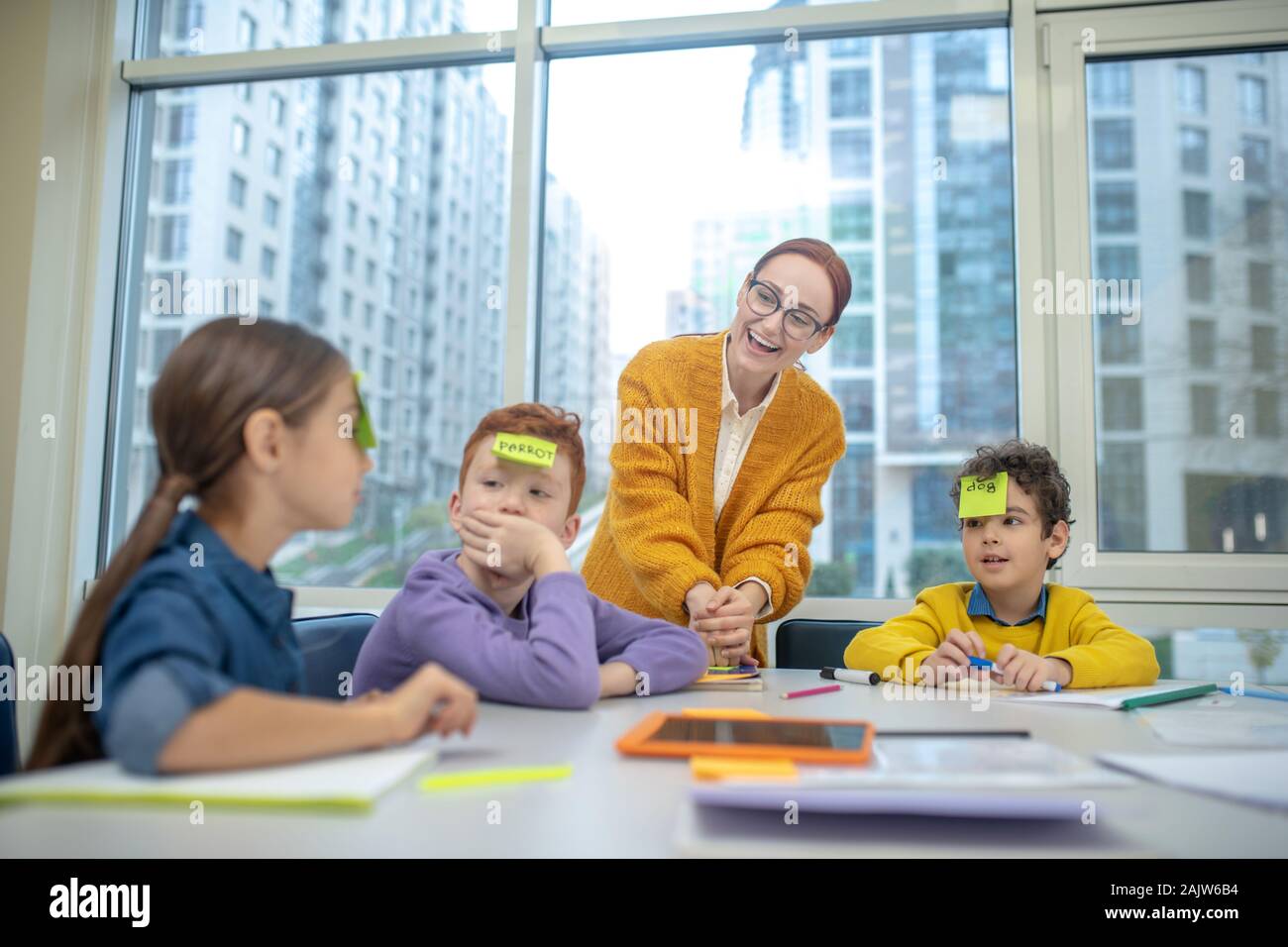 Elementary school children learning words while playing Stock Photo - Alamy