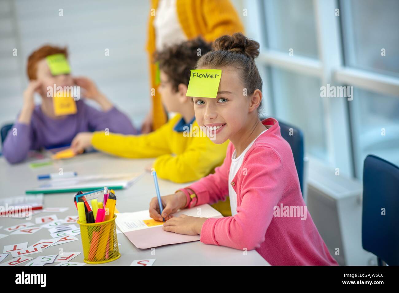 Pupils playing learning vocabulary during the lesson Stock Photo - Alamy
