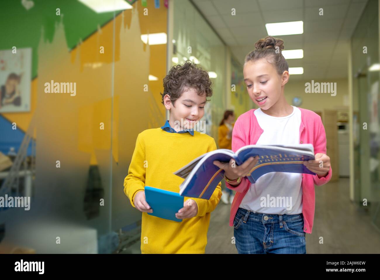 School children discussing their homework before the lesson Stock Photo ...
