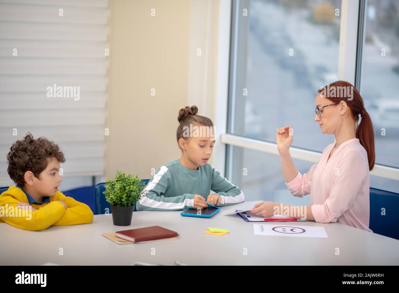 Children doing language exercises with their teacher Stock Photo - Alamy