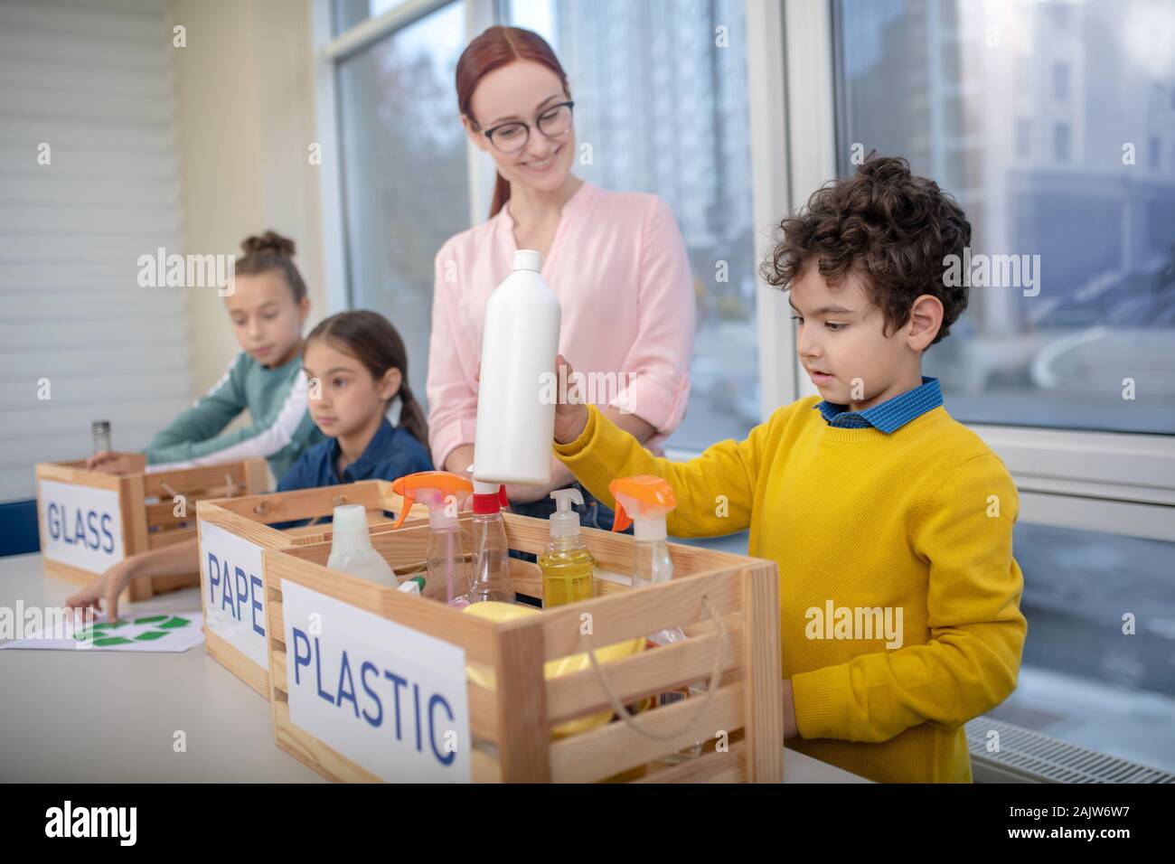 Children learning sorting waste and recycling at school Stock Photo - Alamy