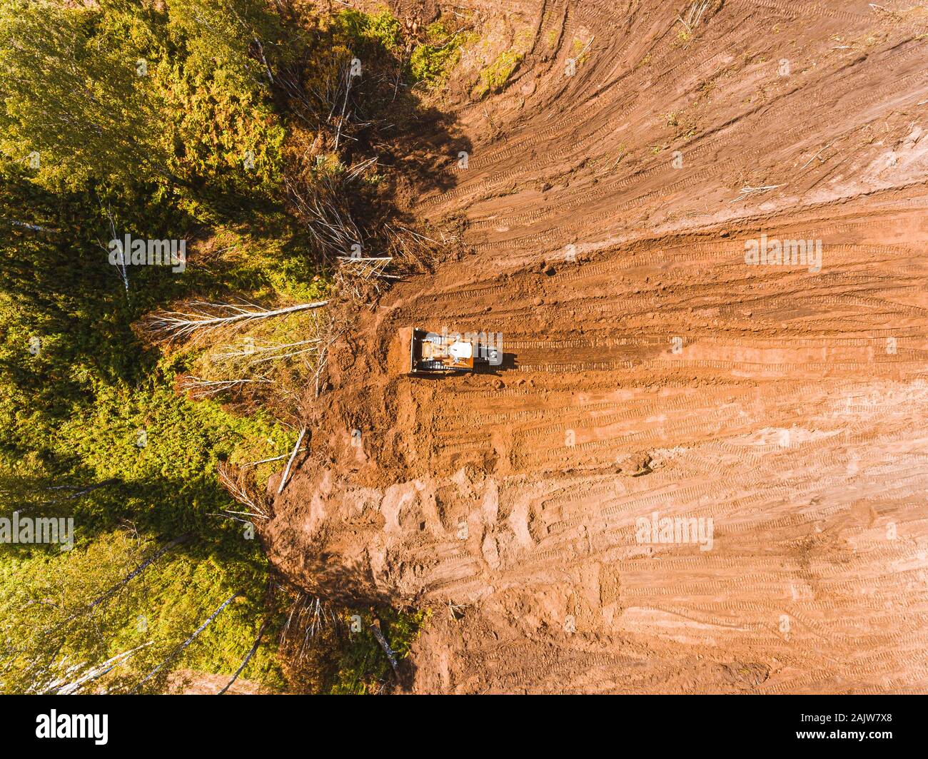 Bulldozer on construction site top view. On the construction site top ...