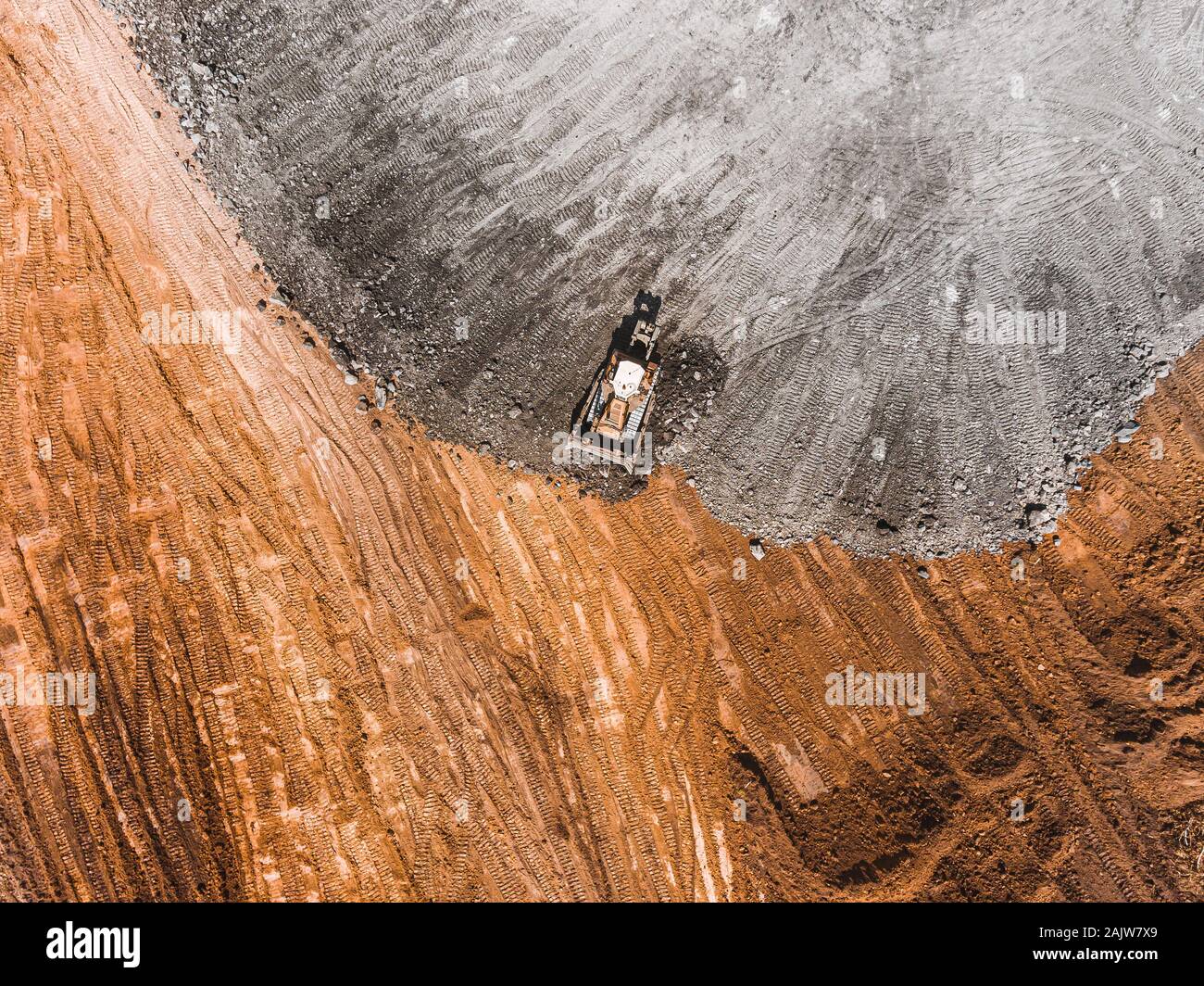 Bulldozer on construction site top view. On the construction site top ...