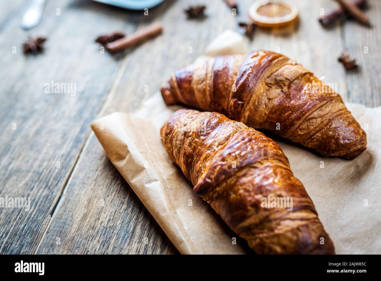 traditional french breakfast, crissant and coffee and juice on wood ...