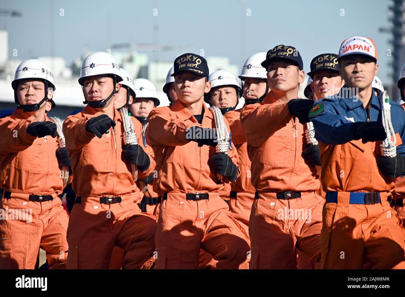 Tokyo, Japan. 6th Jan, 2020. Firefighters march past the reviewing ...