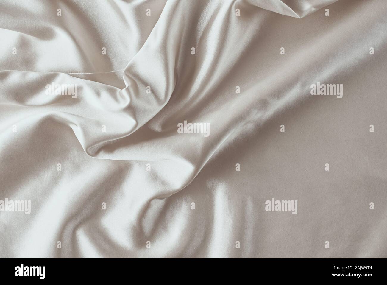 Golden light silk background with folds. Abstract texture of rippled ...