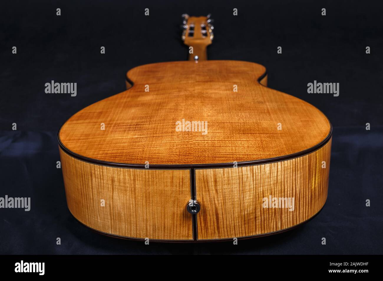 wood texture of lower deck of six strings acoustic guitar on black ...