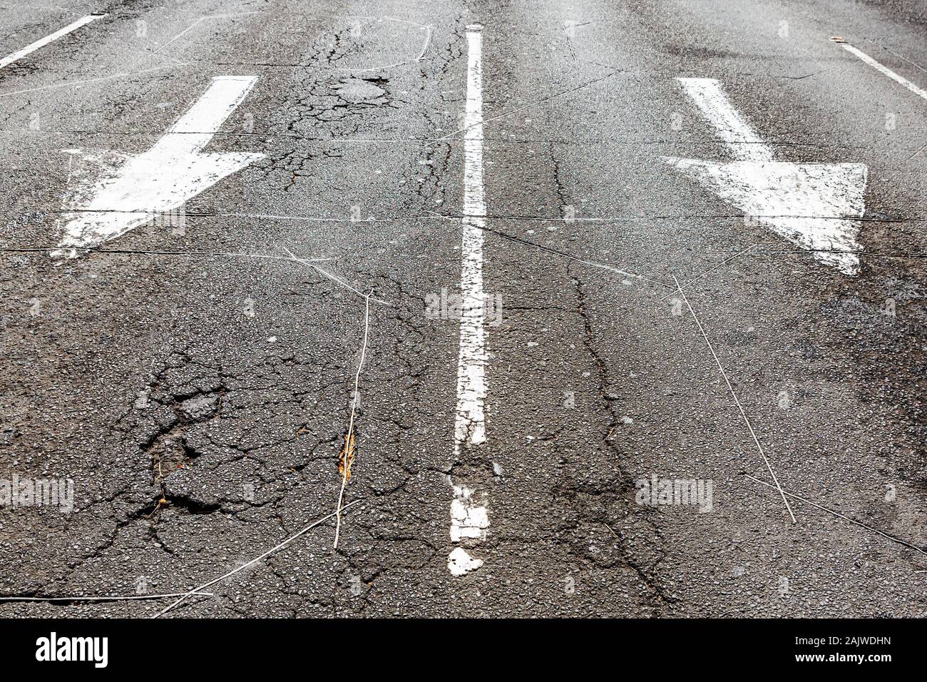picture of a damaged road with road signs Stock Photo - Alamy