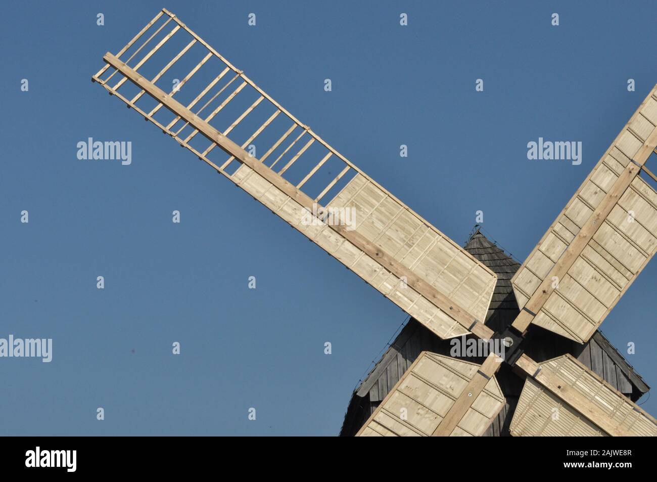 Wooden windmill. Monument. Antique mill powered by the wind Stock Photo ...