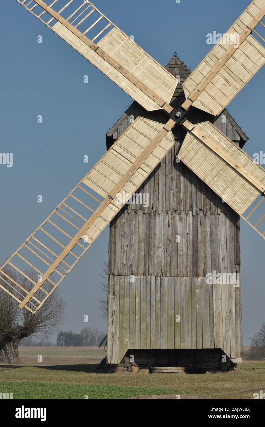 Wooden windmill. Monument. Antique mill powered by the wind Stock Photo ...