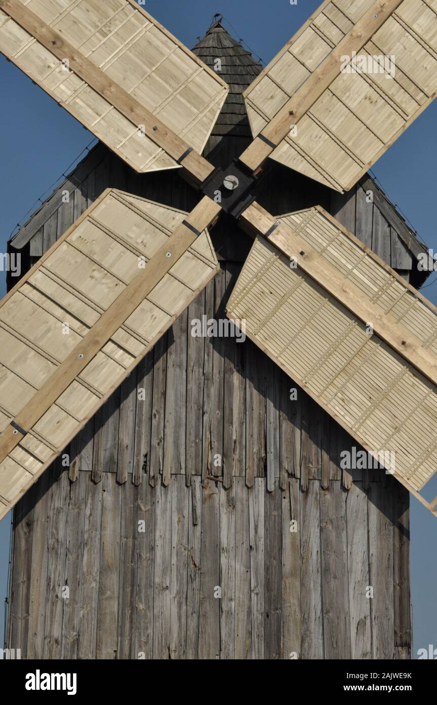 Wooden windmill. Monument. Antique mill powered by the wind Stock Photo ...