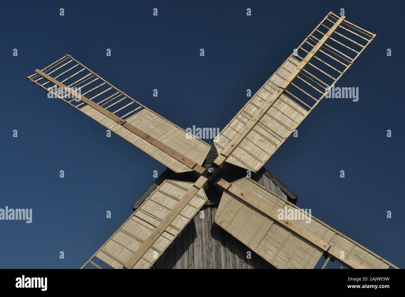 Wooden windmill. Monument. Antique mill powered by the wind Stock Photo ...
