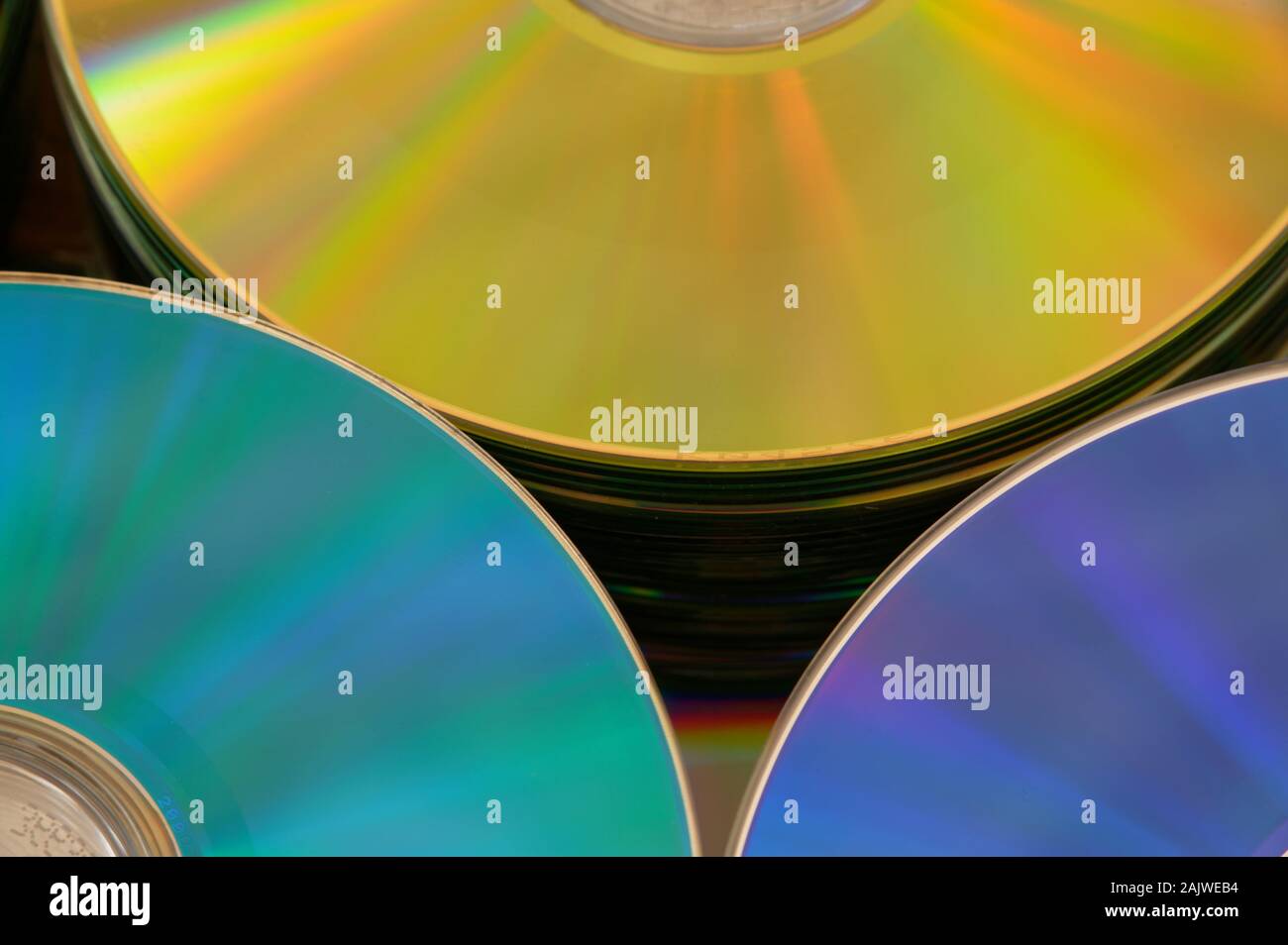 Three piles of different coloured cds Stock Photo - Alamy