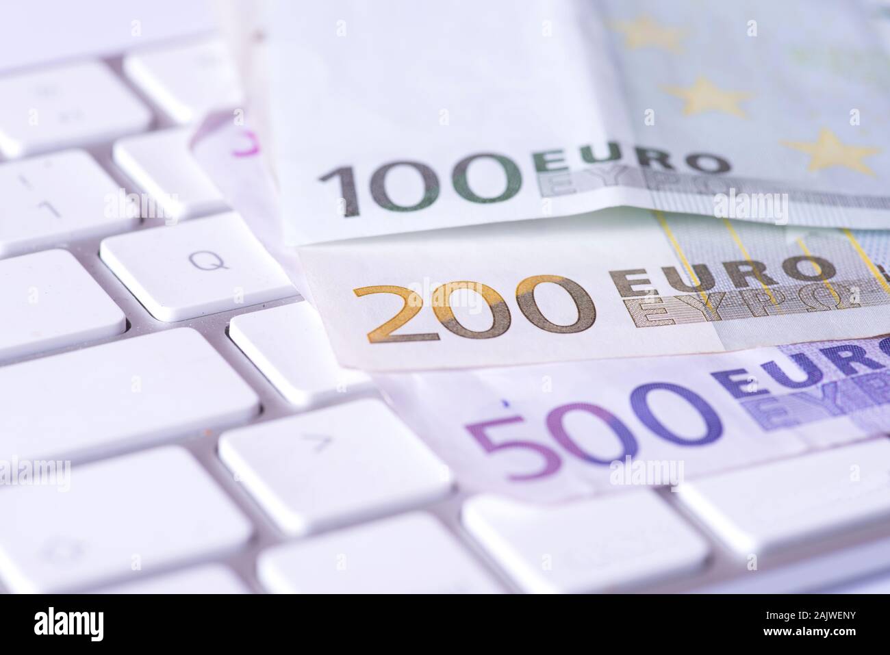 Computer and euro banknotes Stock Photo - Alamy
