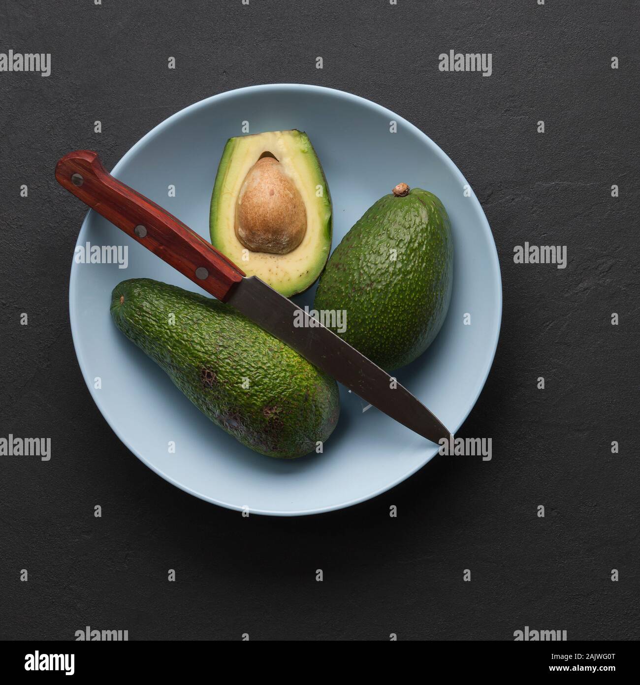 whole and cut avocado, close-up. healthy food ingredient Stock Photo ...