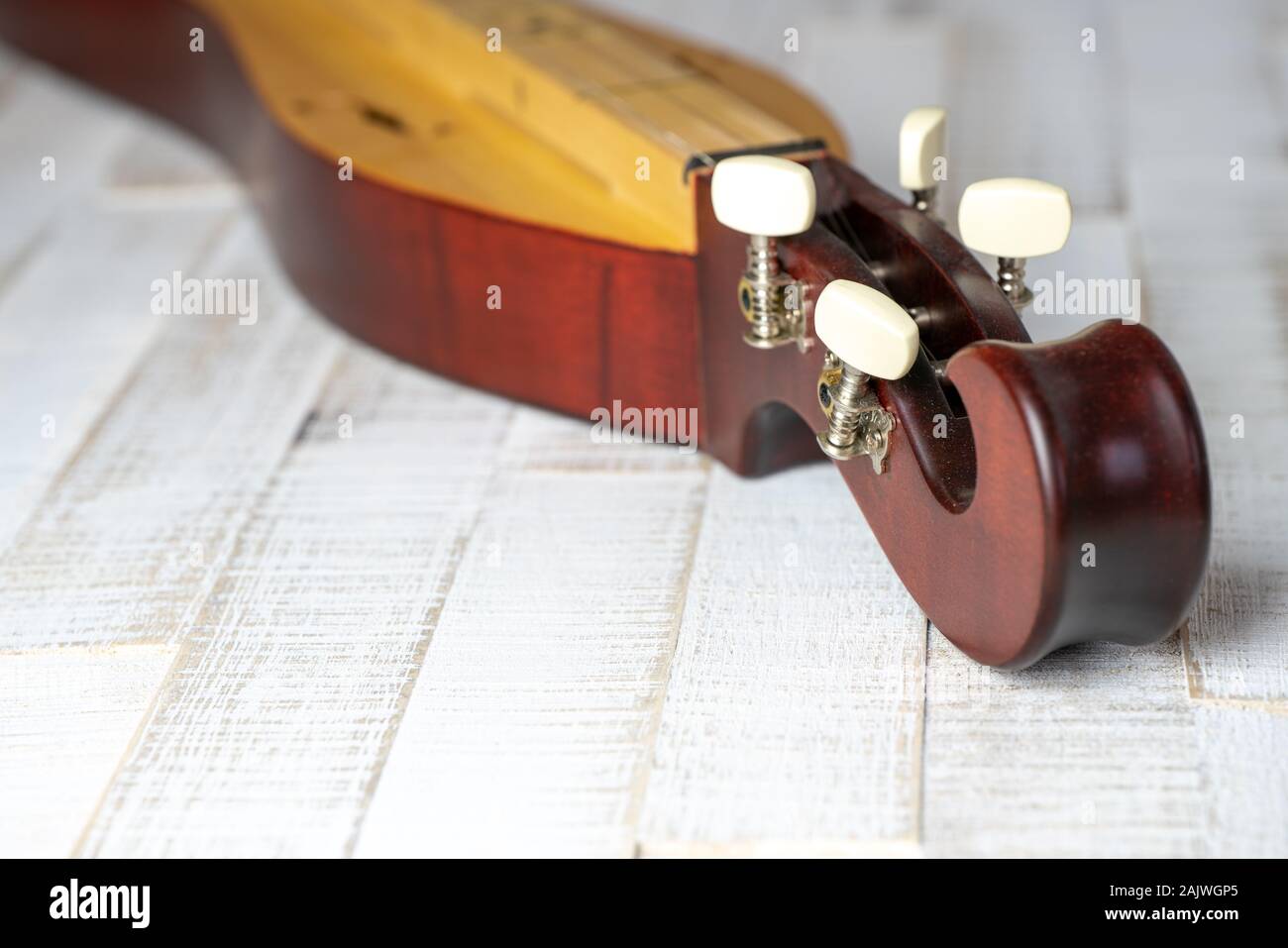 Detail view of an Appalachian mountain dulcimer musical instrument on a ...