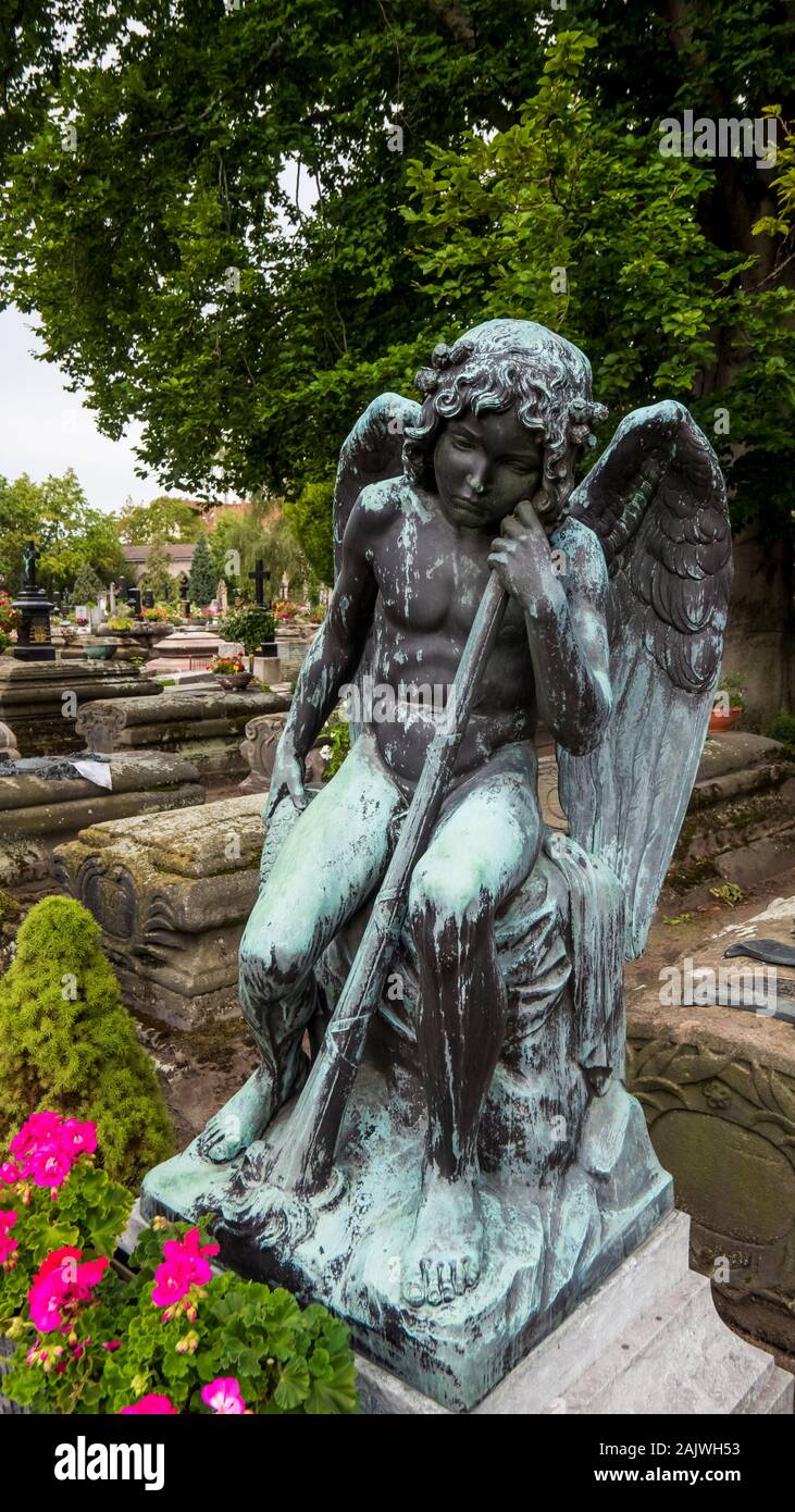 Nuremberg 2019. Bronze child angel statue, aged by time, on a burial in ...