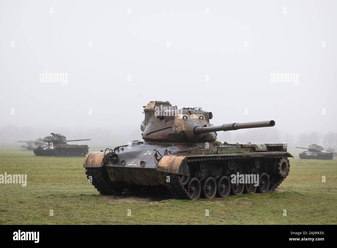 Abandoned derelict American tanks in a field with mist in Germany Stock ...