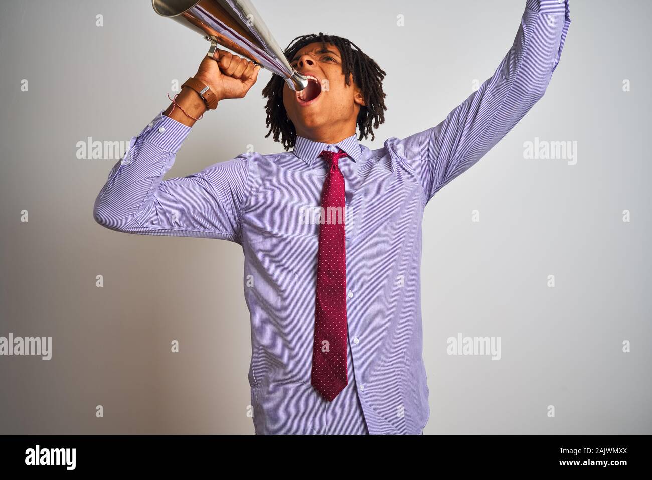 Young african american businessman screaming using vintage megaphone ...
