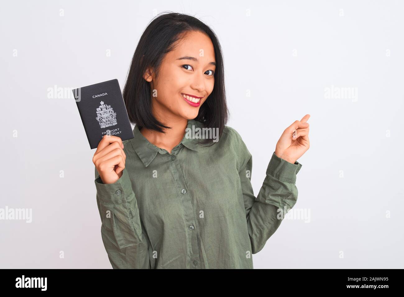 Beautiful chinese woman holding Canada Canadian passport over isolated ...