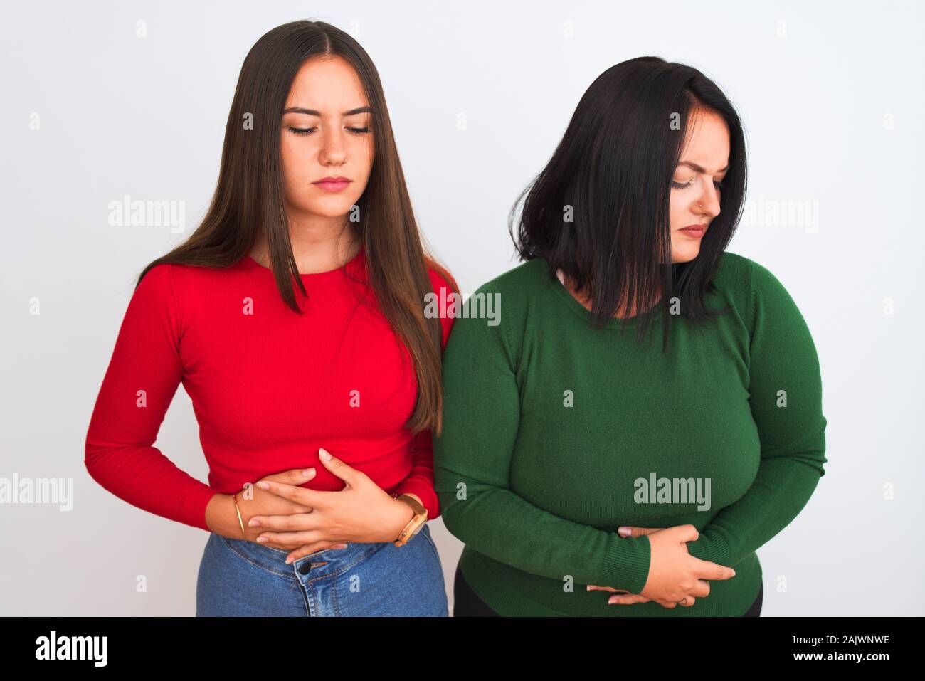 Young beautiful women wearing casual clothes standing over isolated ...