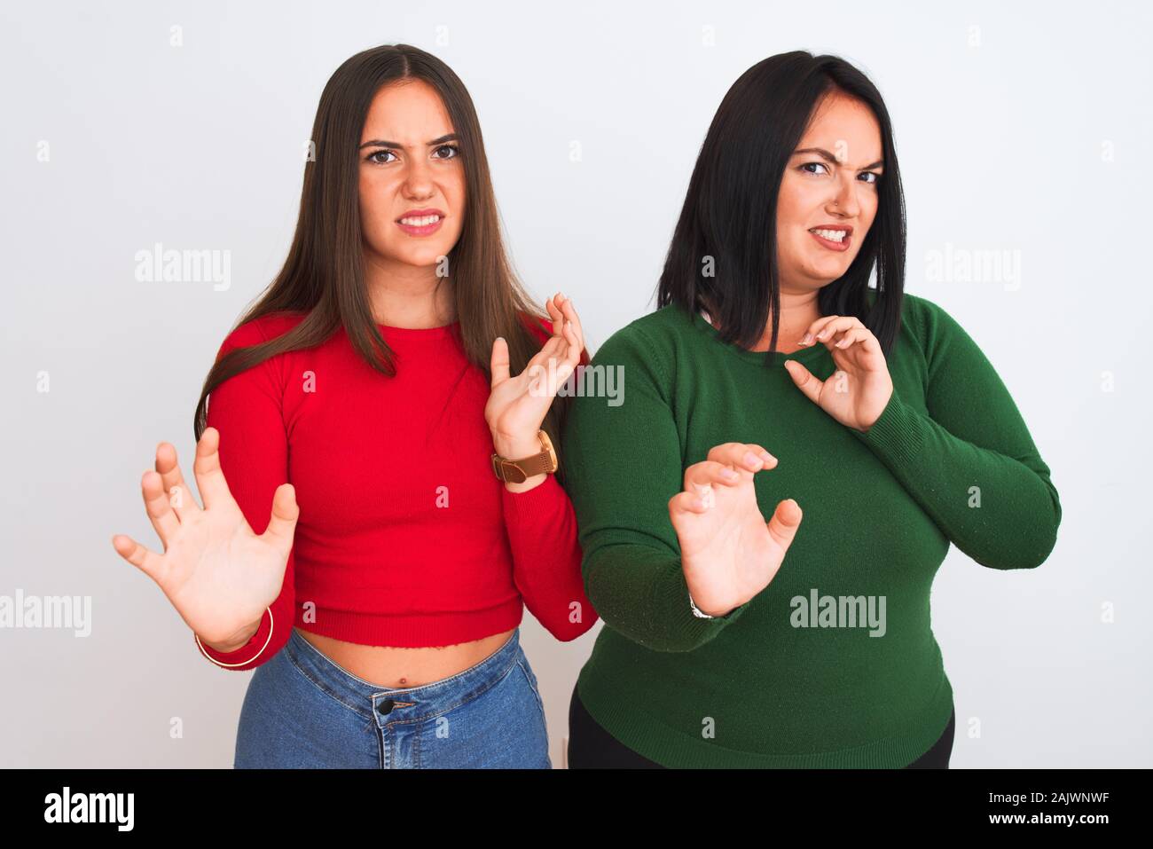 Young beautiful women wearing casual clothes standing over isolated ...