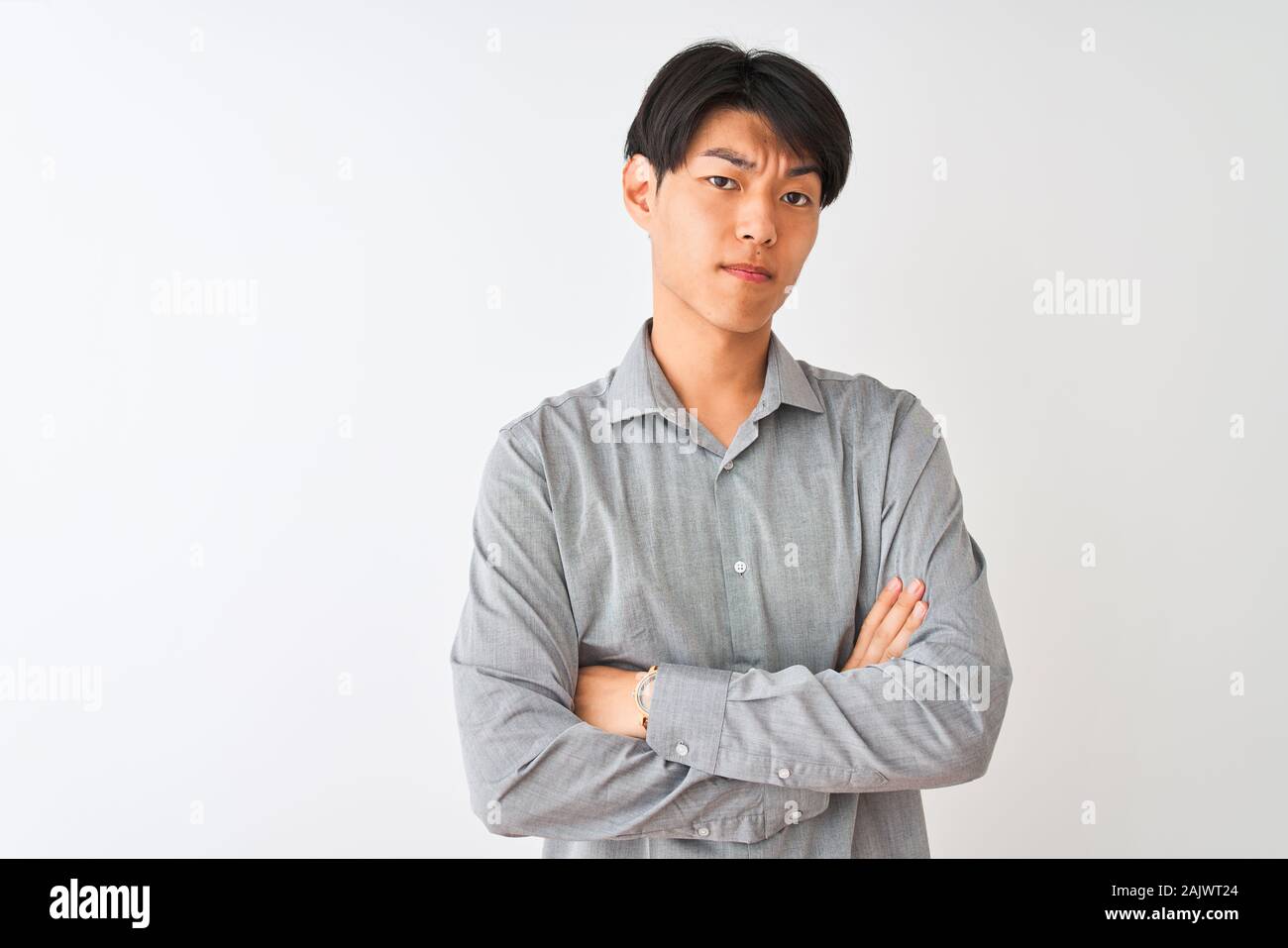 Chinese businessman wearing elegant shirt standing over isolated white ...