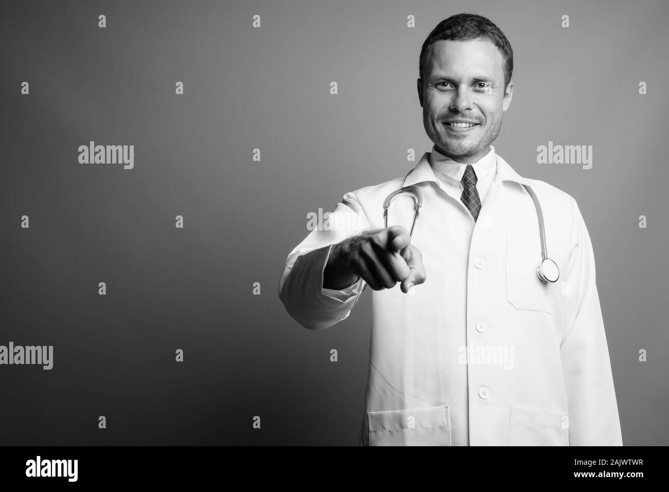 Portrait male doctor pointing camera Black and White Stock Photos ...