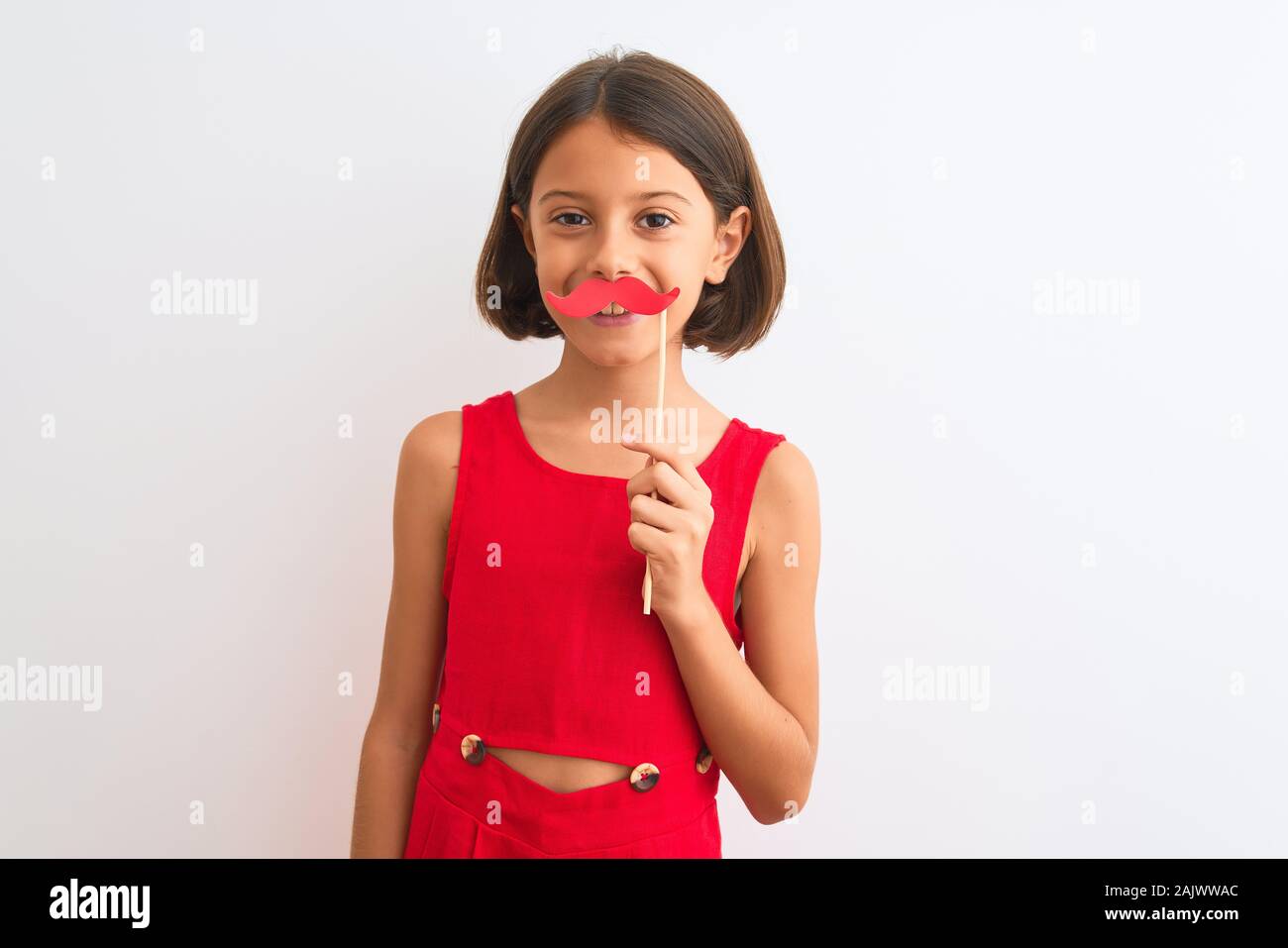 Beautiful child girl holding fanny party mustache standing over ...