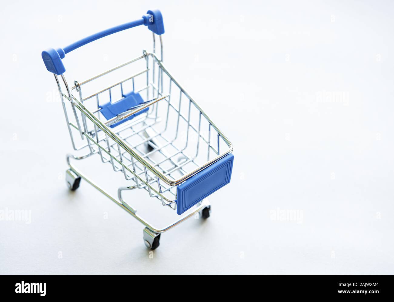 Small supermarket grocery push cart for shopping on white background ...
