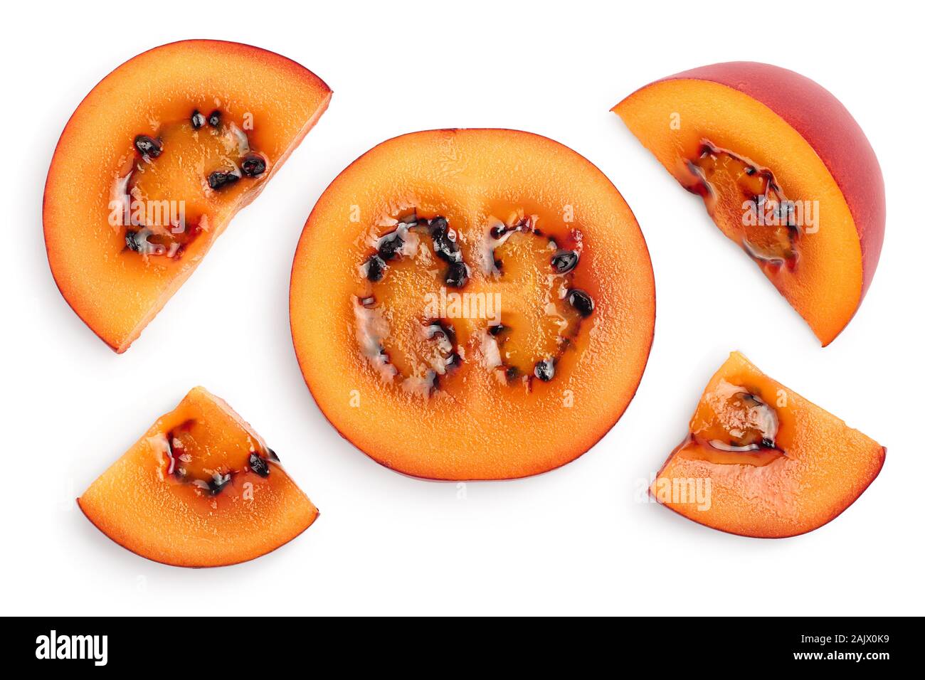 Fresh tamarillo fruit slices with leaves isolated on white background ...