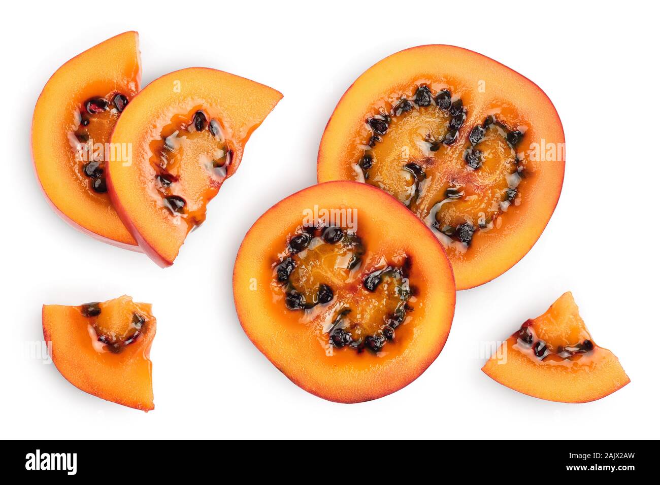 Fresh tamarillo fruit slices with leaves isolated on white background ...