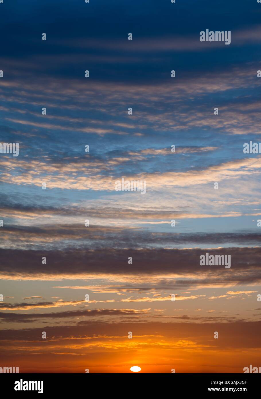 Fantastic clouds at sunrise, vertical panorama Stock Photo - Alamy