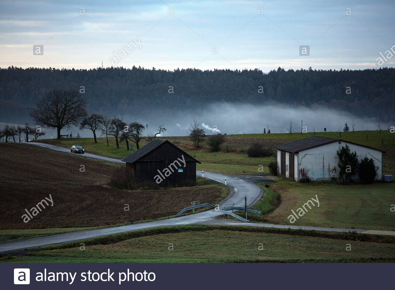 Early dawn scene in Franconia, Germany above the town of Grub am Forst ...