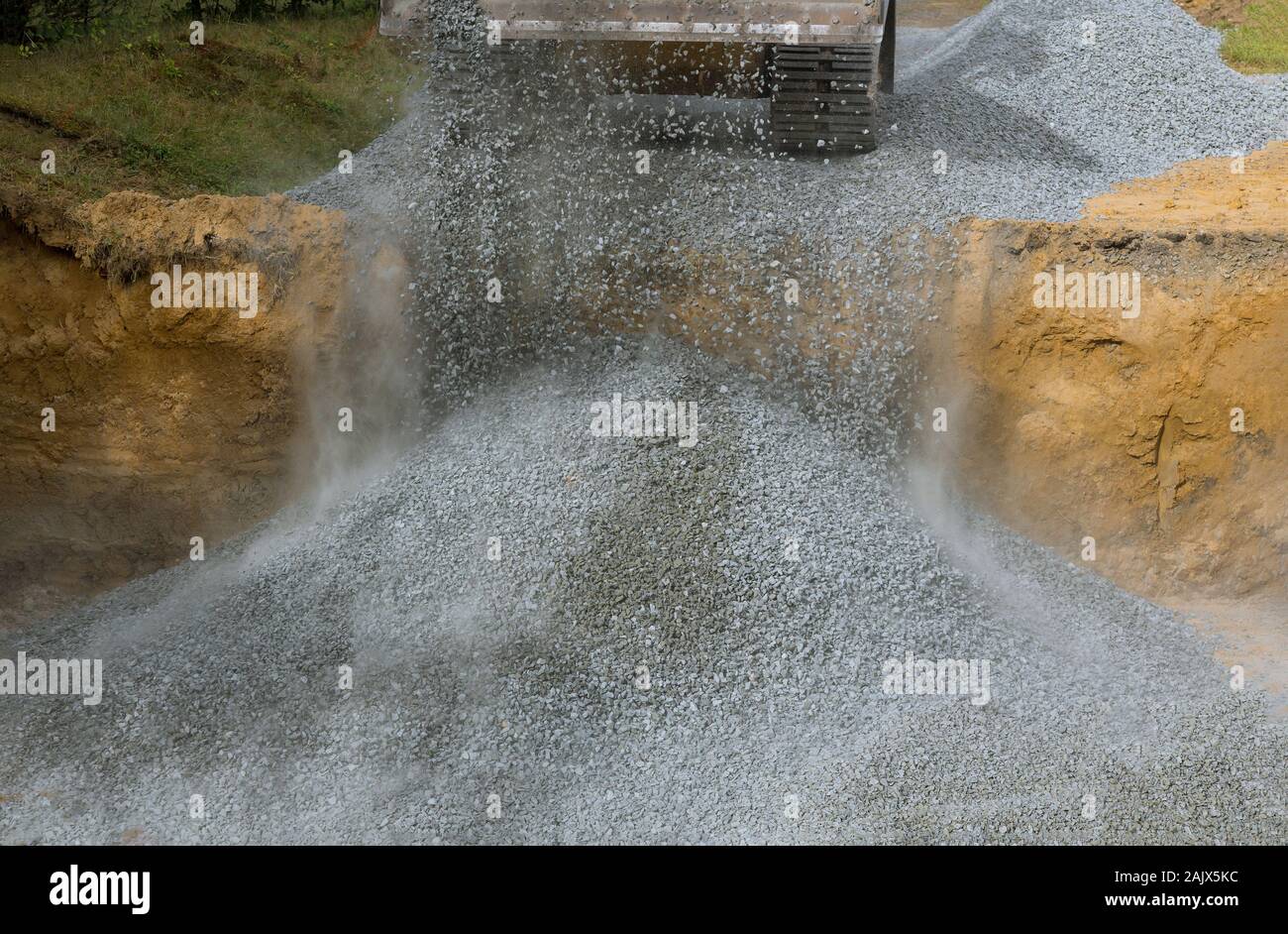 Excavator at a construction excavator with a bucket lowered down Stock ...