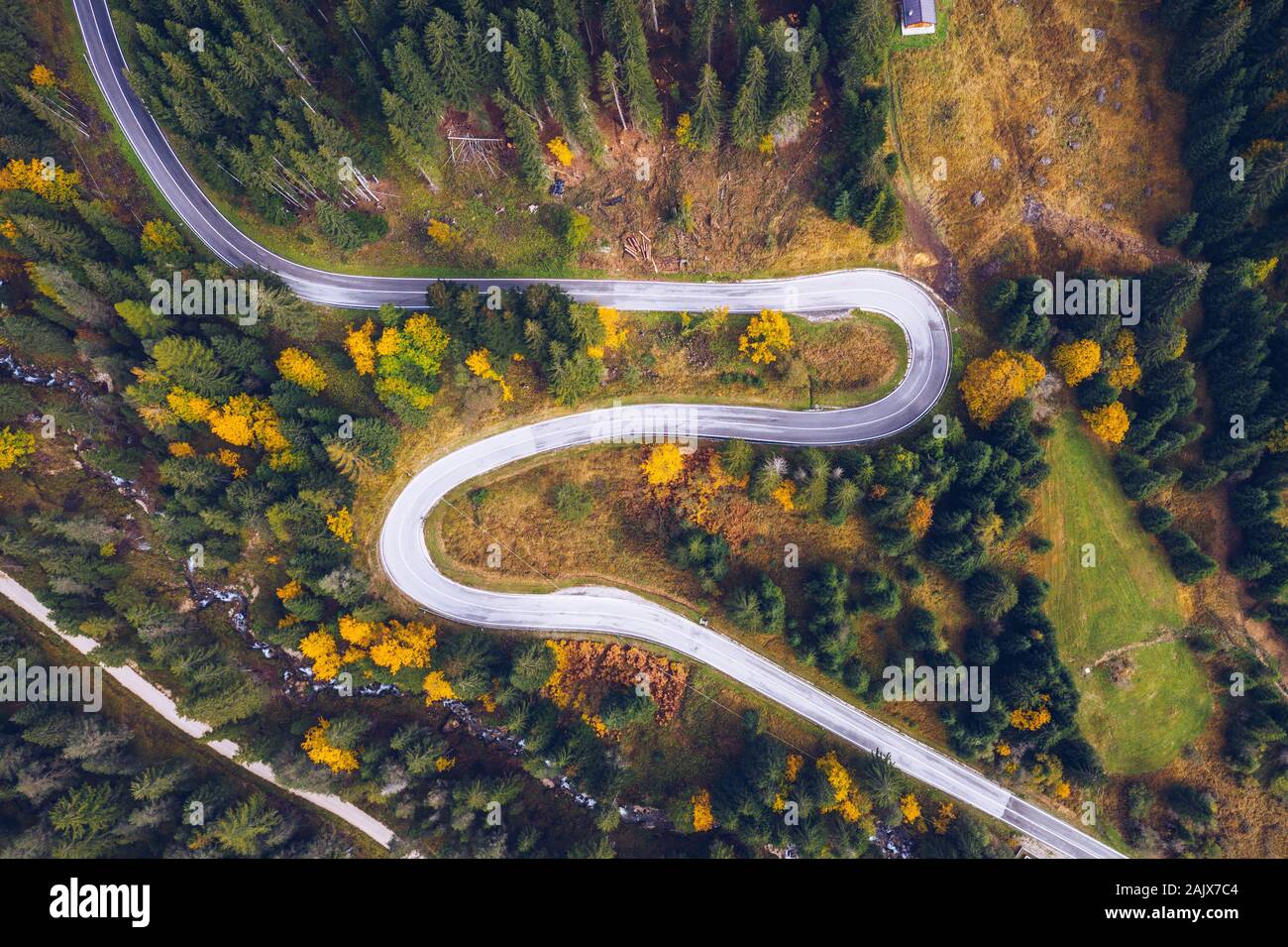Curved bending road in the forest. Aerial image of a road. Forrest ...