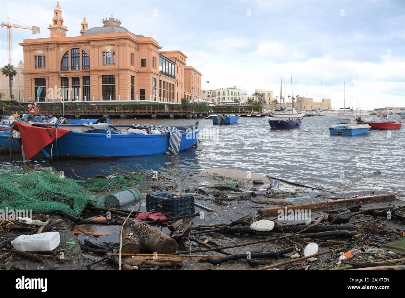 Plastic and microplastic waste and garbage floating in the water with ...