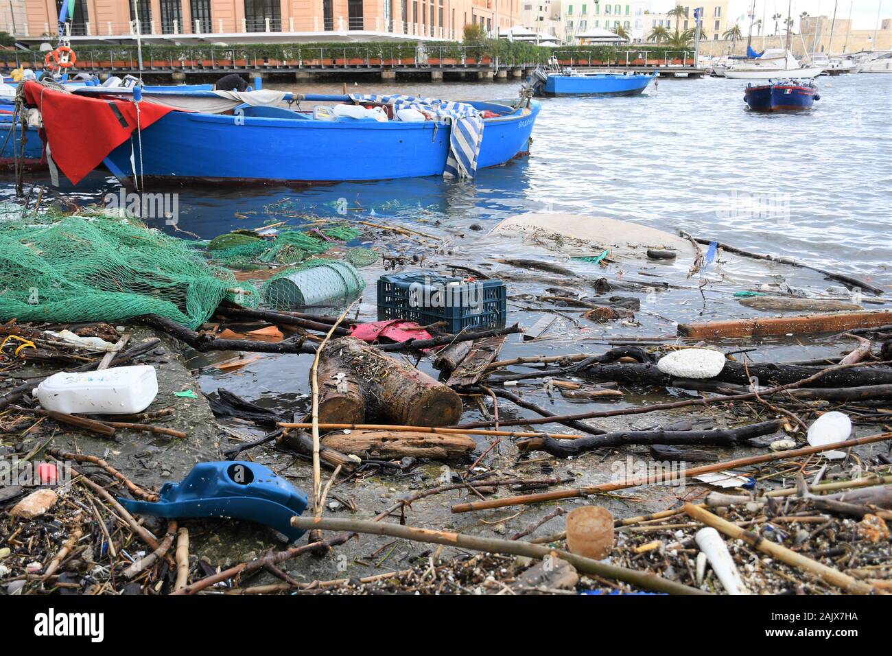 Plastic and microplastic waste and garbage floating in the water with ...