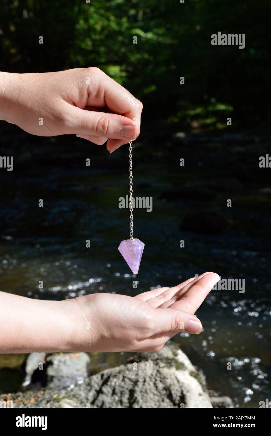Pendulum dowser to search for water sources Stock Photo - Alamy