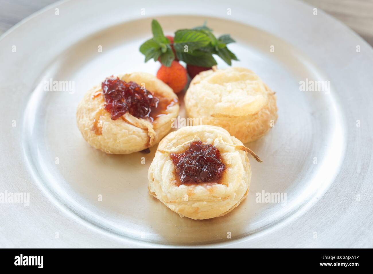 Goat curl puff pastry with caramelized pepper. Image made with natural ...