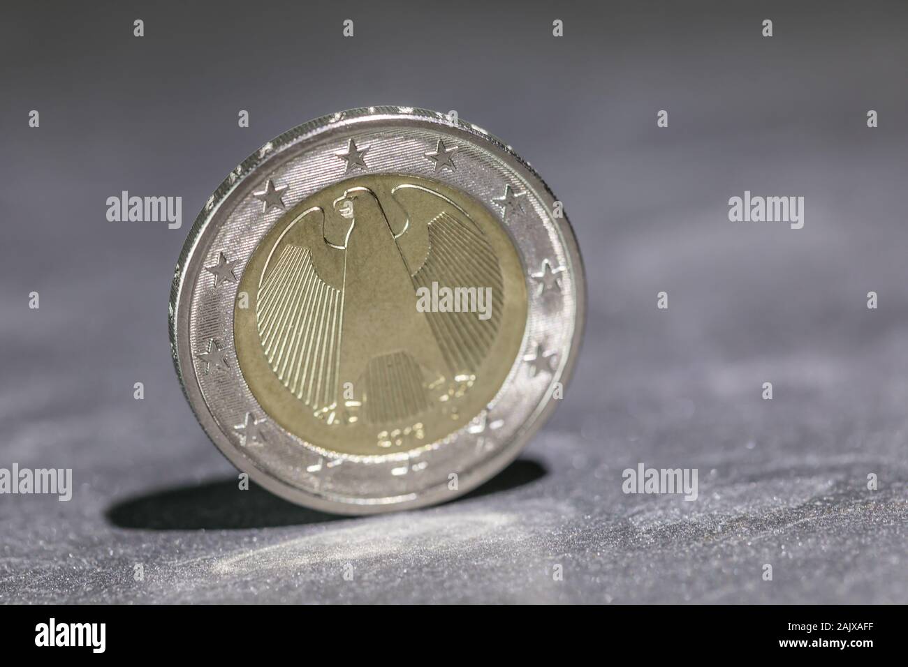 federal eagle on the back side of two euro coin Stock Photo - Alamy