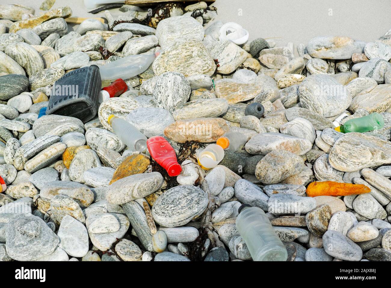 Beach litter - showing discarded plastic bottles and containers Stock ...