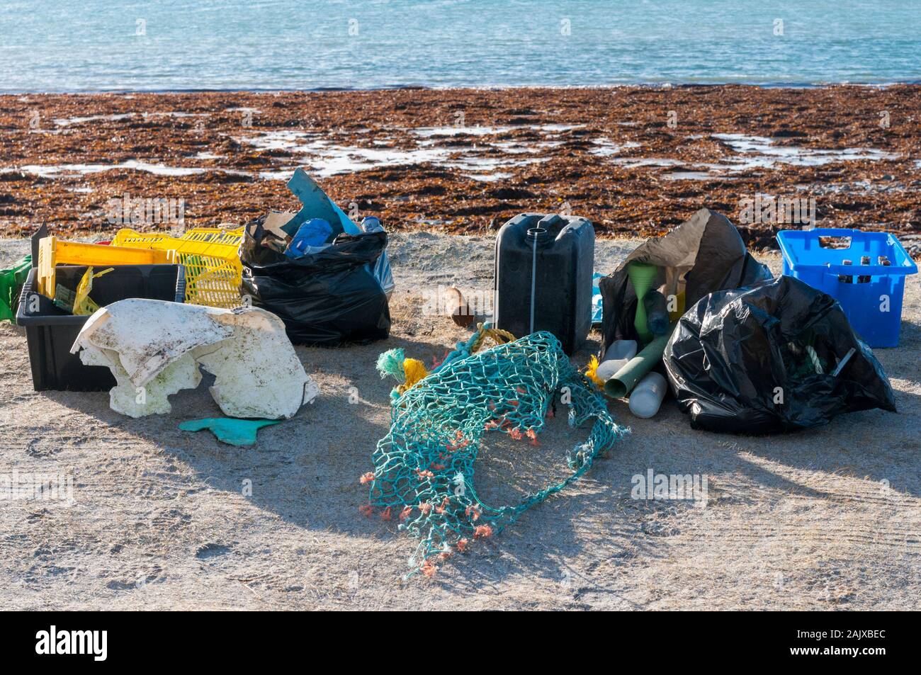 Beach litter - showing collected plastic and rope debris Stock Photo ...