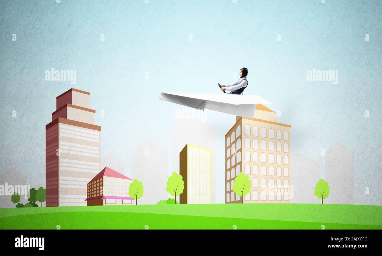 Aircraft pilot flying in paper plane Stock Photo - Alamy