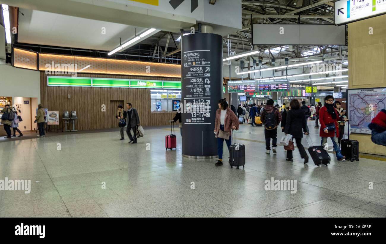 TOKYO, JAPAN - FEBRUARY 5, 2019: Commuters at Japanese subway station ...