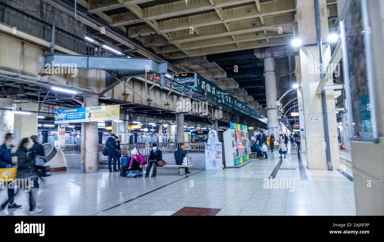 TOKYO, JAPAN - FEBRUARY 5, 2019: Commuters at Japanese subway station ...