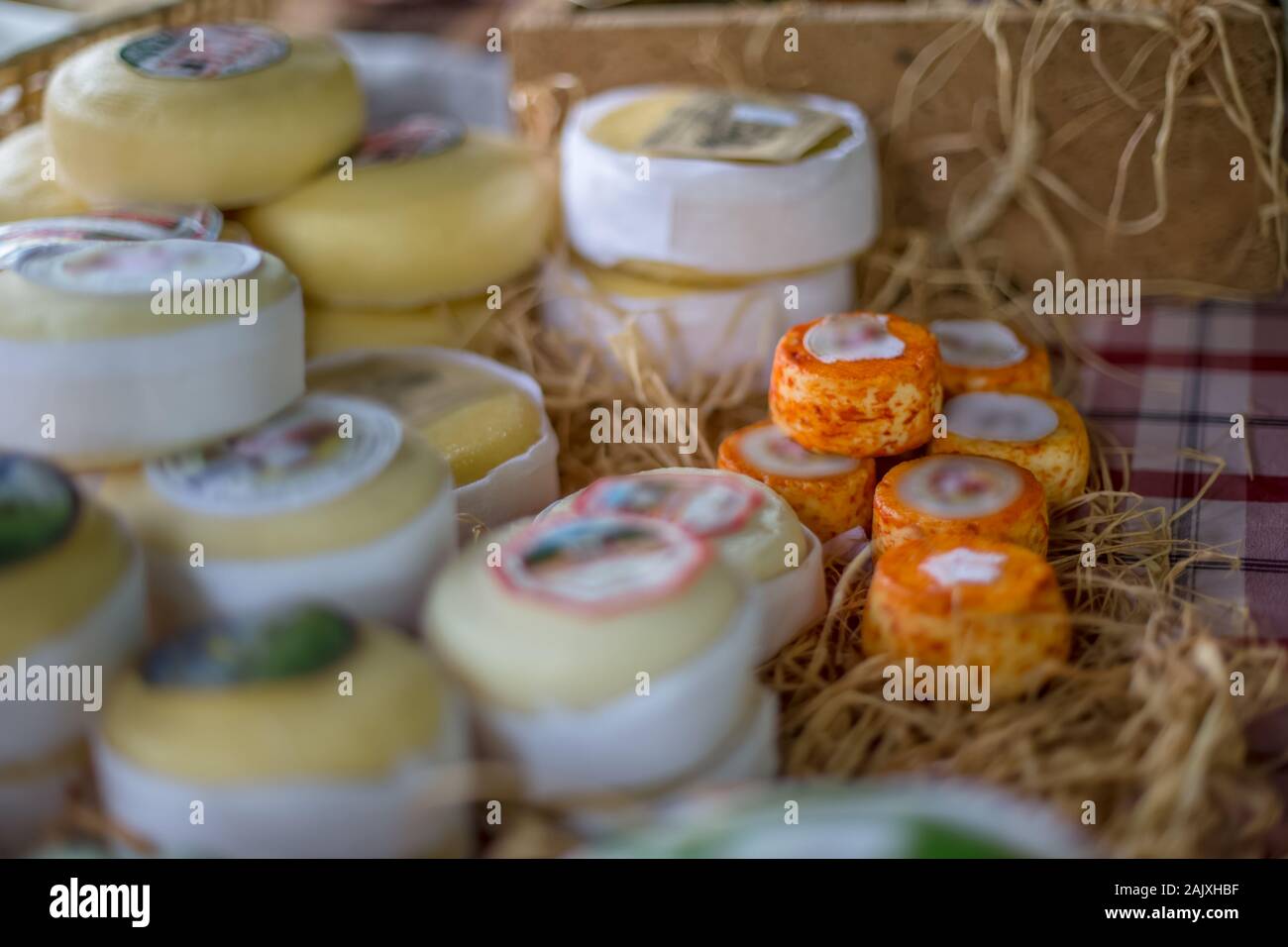 View of a cheese selling table with decoration, rustic atmosphere and ...